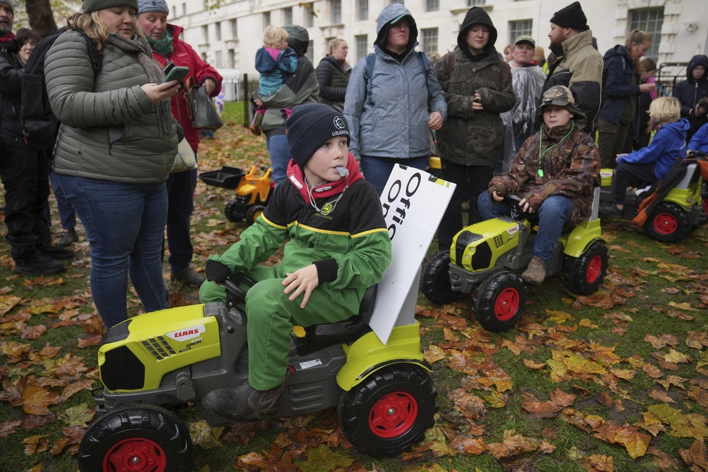 Thousands of UK farmers descend on Parliament to protest a tax they say ...